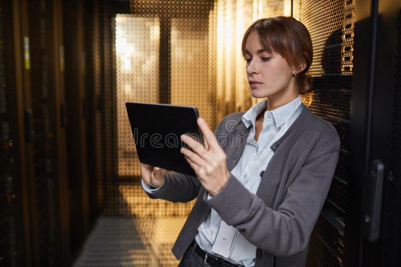Examining Data on Tablet in Server Room Setting Stock Photo - Image of ...
