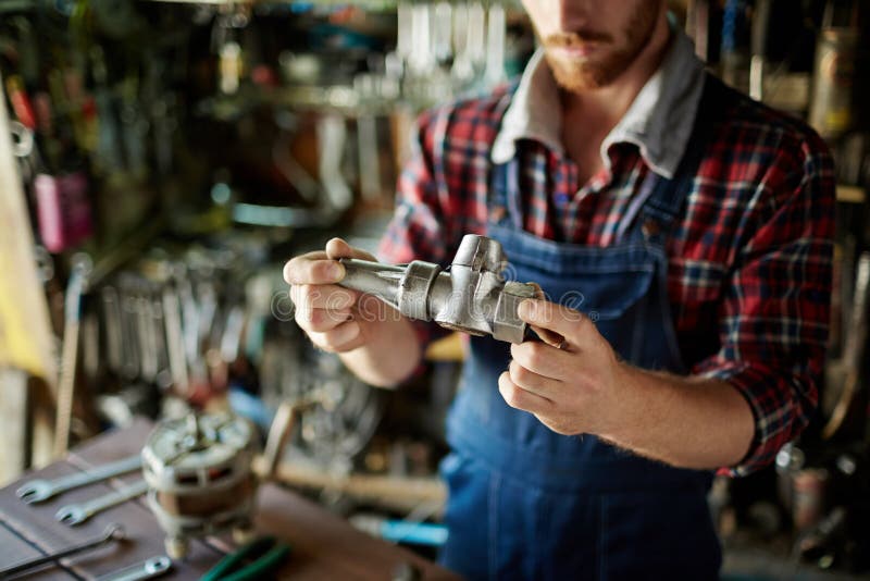 Examining detail stock photo. Image of human, adult, repair - 74007200