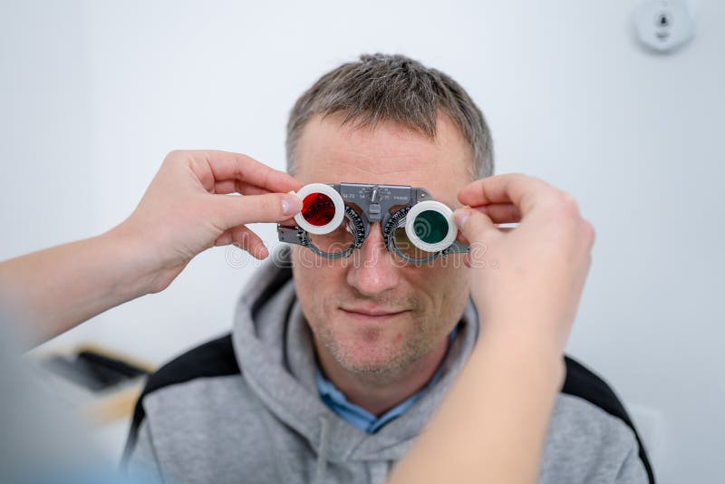 Examining Patient Vision. Eye Exam. Optometrist Checking Patient ...