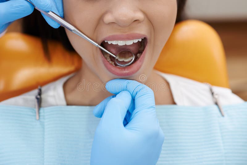 Examining teeth and gums stock photo. Image of oral, dentistry - 61055980