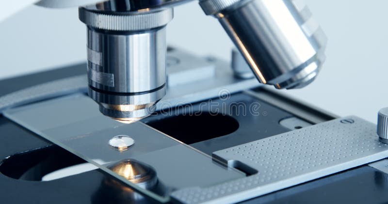 Close Up of Examining of Test Sample of Microchip Transistor Under the ...