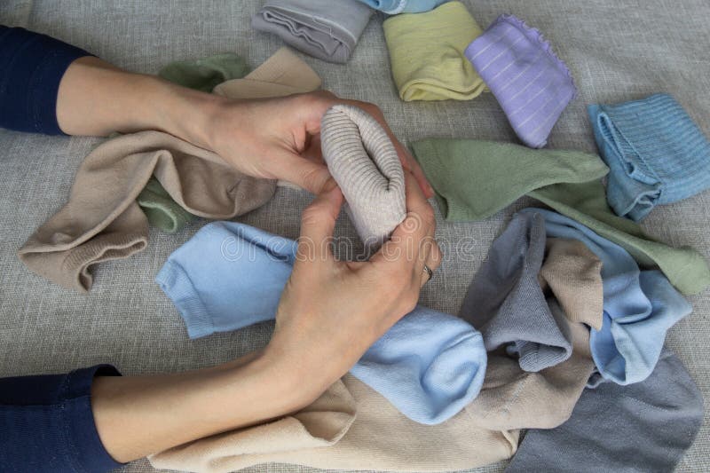 An Example of How To Fold a Pair of Socks. Roll of Socks in Female ...