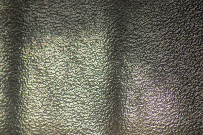 An Example of the Surface of Embossed Glass Under Natural Sunlight. a ...