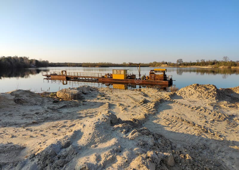 Excavation Machine at Earthmoving Work in Sand Quarry. Extraction of ...