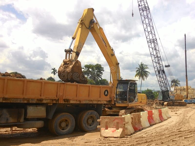 Excavation Work Using Excavator Machine at the Construction Site ...