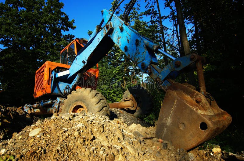 Retro excavator in action stock photo. Image of rock, evening - 7771618