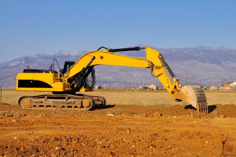 Excavator in the action stock photo. Image of ground - 21894490