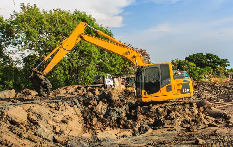 Excavator in action stock image. Image of earth, mining - 64482091