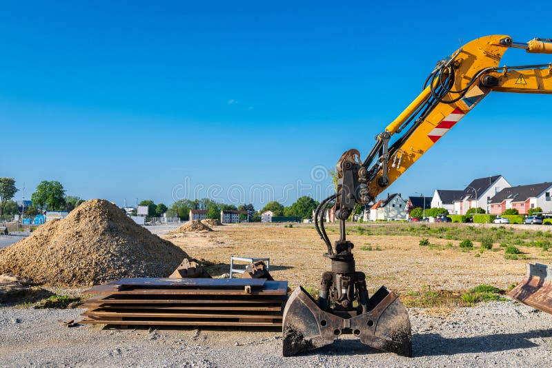 Excavator Boom with Bucket on the Background of Construction Sites ...