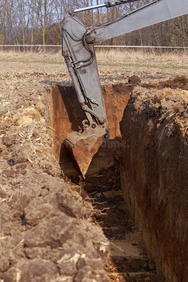 Excavator boom and bucket stock photo. Image of development - 276219010