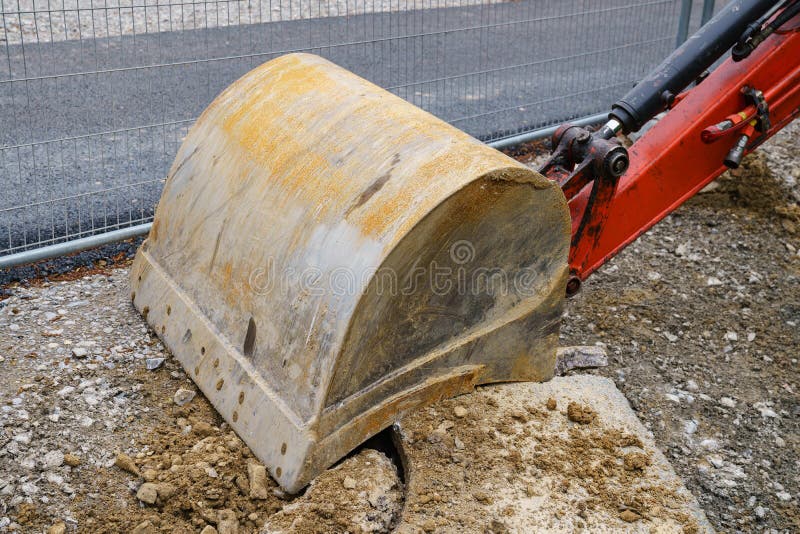 Excavator Bucket Breaking a Concrete Slab Stock Photo - Image of debris ...