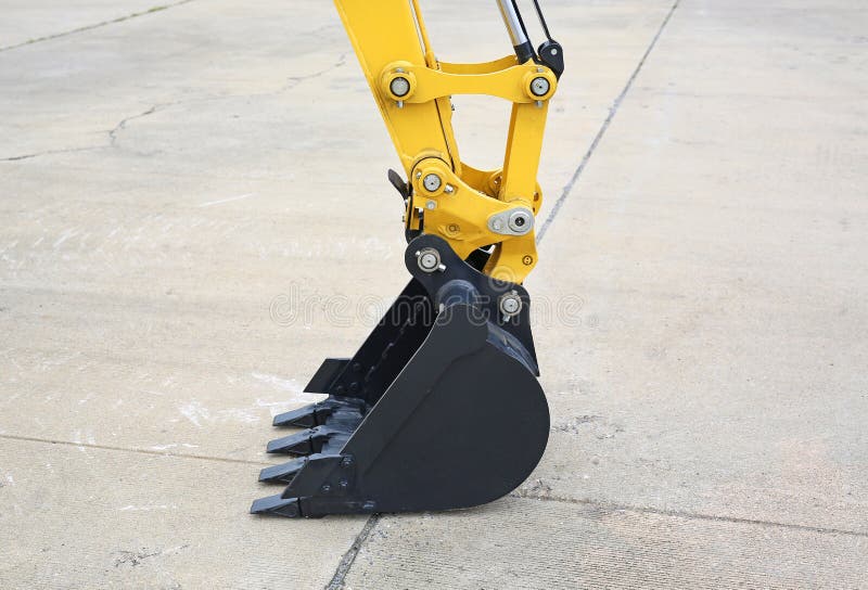 Excavator Bucket on Cement Ground Stock Image - Image of bucket ...