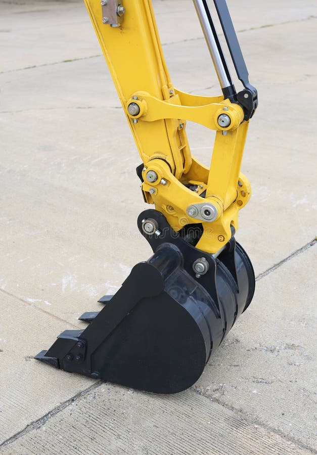 Excavator Bucket on Cement Ground Stock Photo - Image of heavy ...