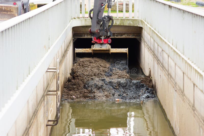 Excavator Bucket Digging Mud and Dirt Stock Image - Image of closeup ...