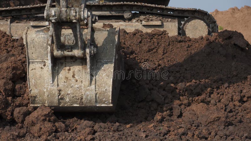 Excavator Bucket Engaging with Soil Dynamic Action on Construction Site ...