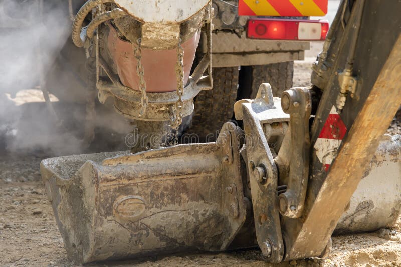 Excavator Bucket Filled with Concrete To Pour Concrete into Formwork ...