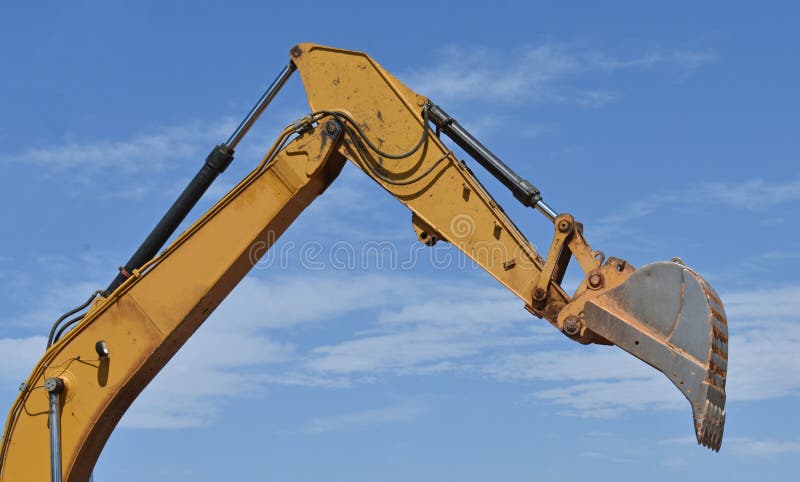 Excavator Bucket Raised Aganst Blue Sky Stock Photo - Image of ...