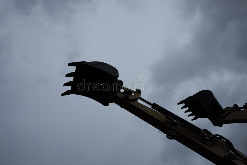 Excavator bucket raised stock photo. Image of vehicle - 112942456