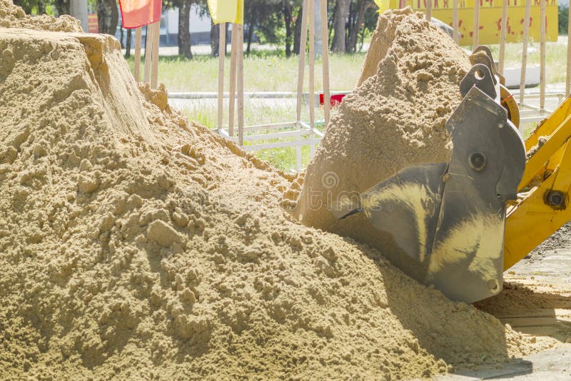 Excavator Bucket with Sand. the Tractor is Rowing Sand Stock Image ...