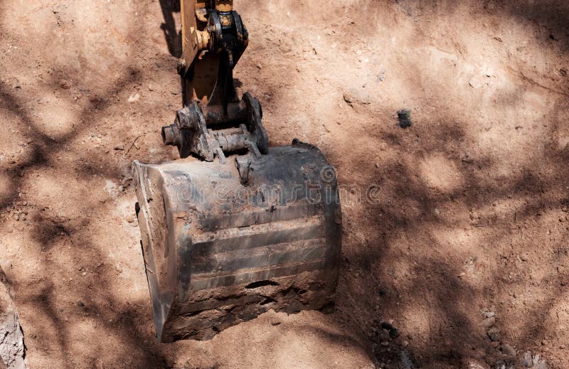 Excavator bucket in work stock photo. Image of construction - 274628992