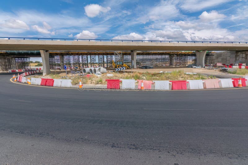 Excavator Building a Road in a Site Construction Stock Photo - Image of ...