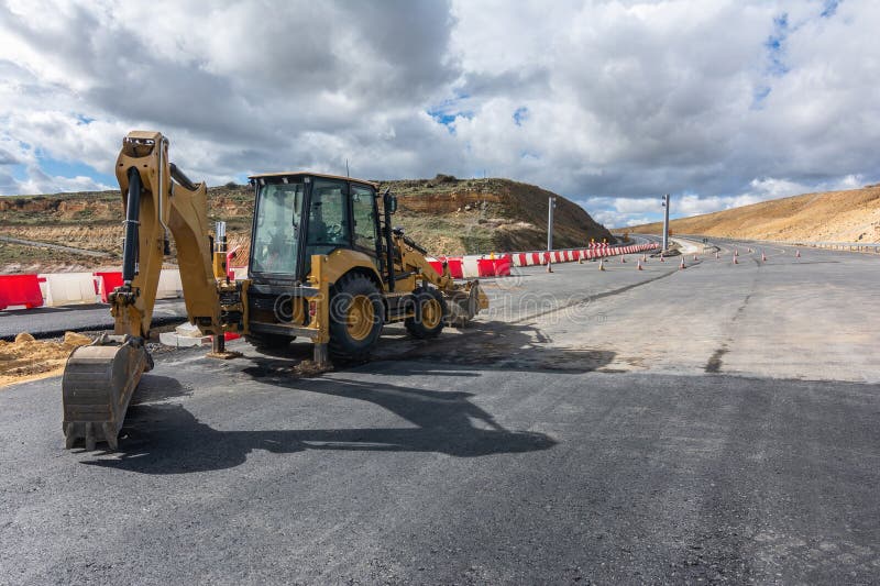 Excavator Building a Road in a Site Construction Stock Image - Image of ...