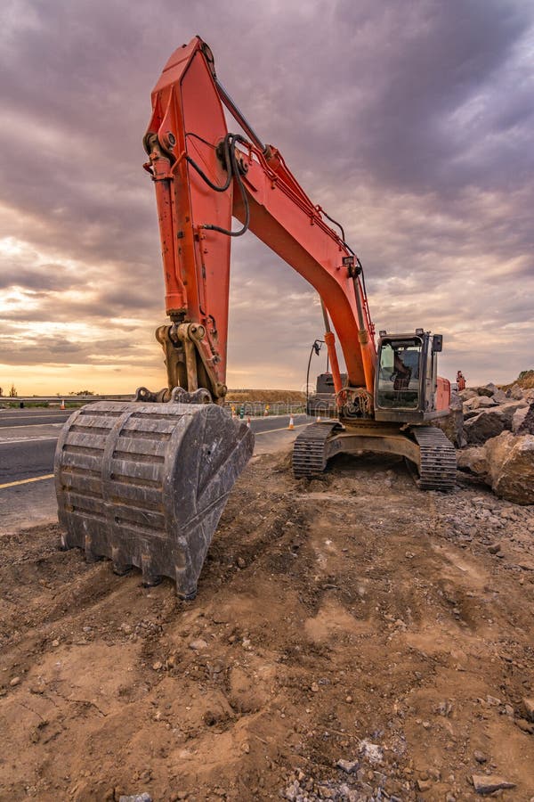 Excavator Building a Highway in a Mountain Location Stock Photo - Image ...