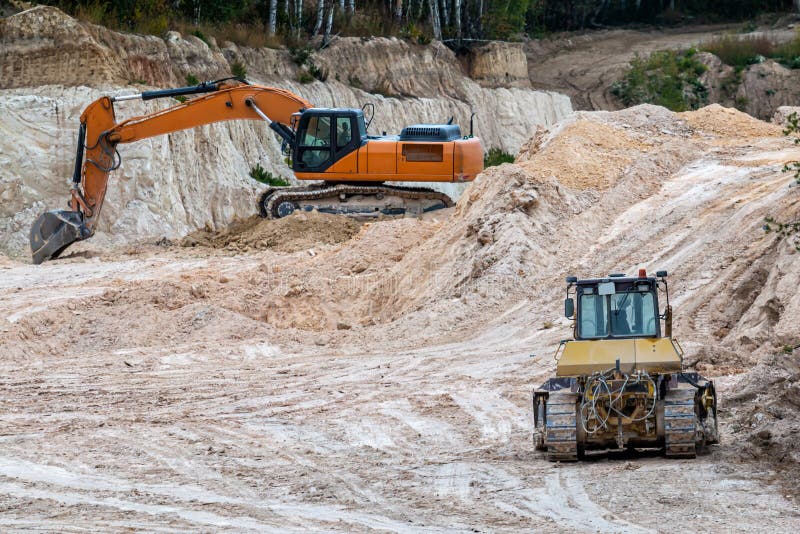Excavator and Bulldozer in Clay Quarry Stock Photo - Image of clay ...