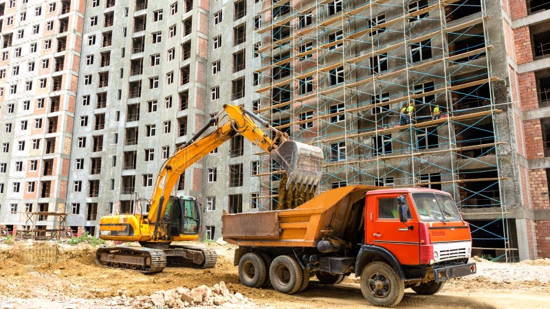 Excavator and Cab Over Truck on the Construction Site Stock Image ...