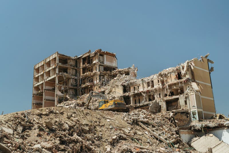 Excavator Clearing Debris from Collapsed Building Stock Image - Image ...