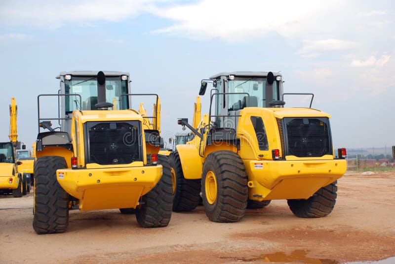 Grader and Excavator Construction Equipment Yard Stock Image - Image of ...