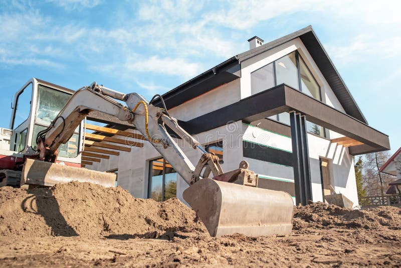 Excavator at the Construction of a New House, during Earthworks. Stock ...