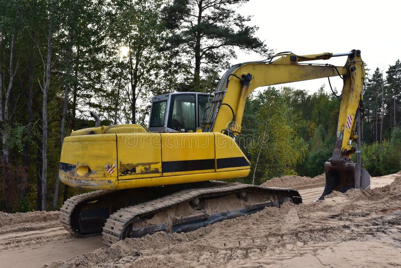 Excavator during Construction New Road in Forest Area. Backhoe at ...