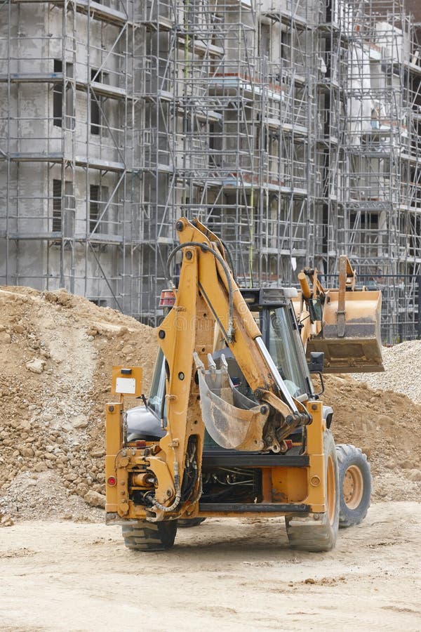 Excavator on a Construction Site. Building in Progress Stock Photo ...