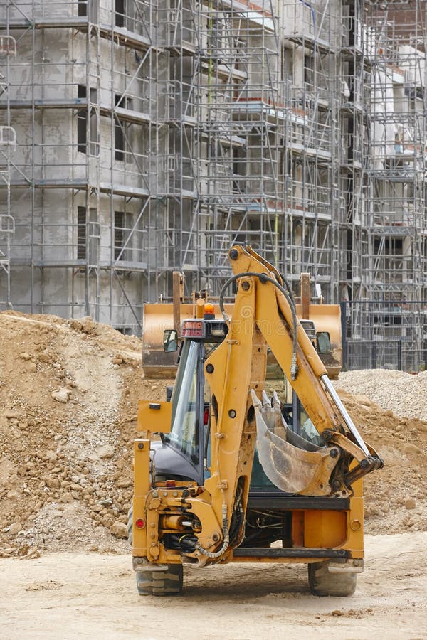 Excavator on a Construction Site. Building in Progress Stock Image ...