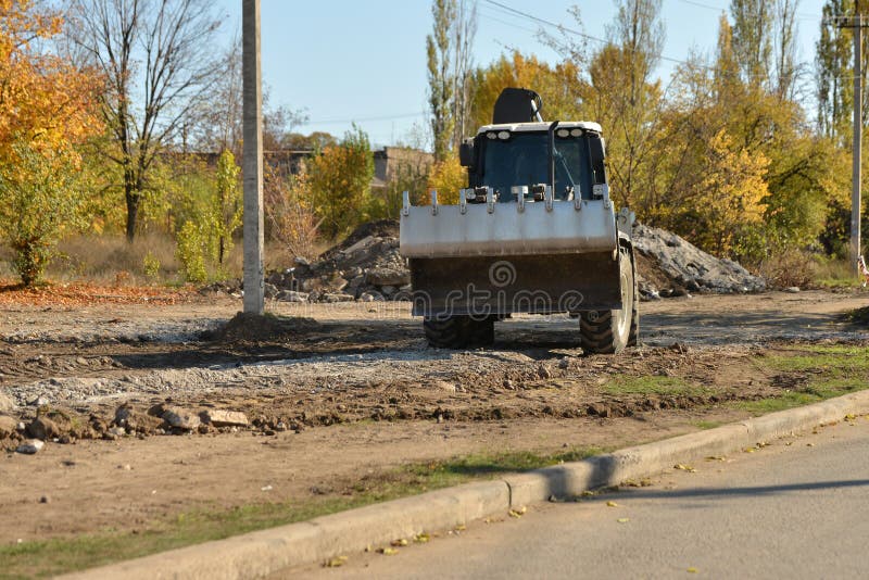 Excavator at a Construction Site Engaged in Land Works Stock Photo ...