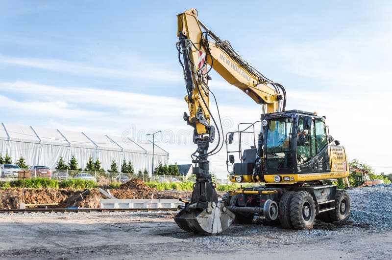 Excavator at a Construction Site Editorial Stock Photo - Image of dozer ...
