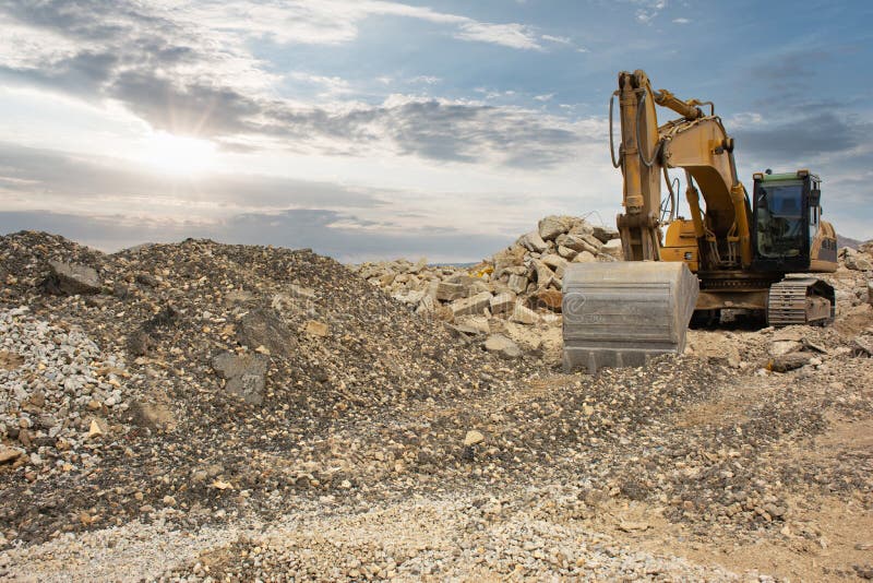 Excavator at a Construction Site in the Extraction of Stone and Rock ...