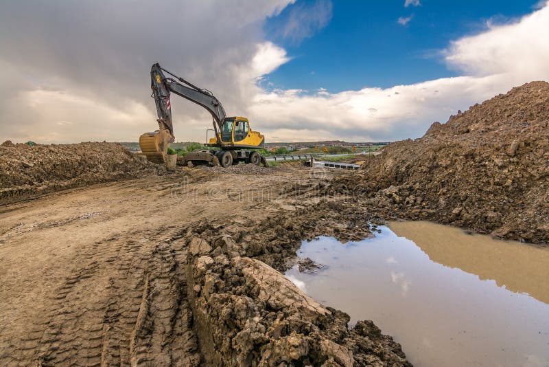 Excavator in a Construction Site with Mud Stock Image - Image of group ...