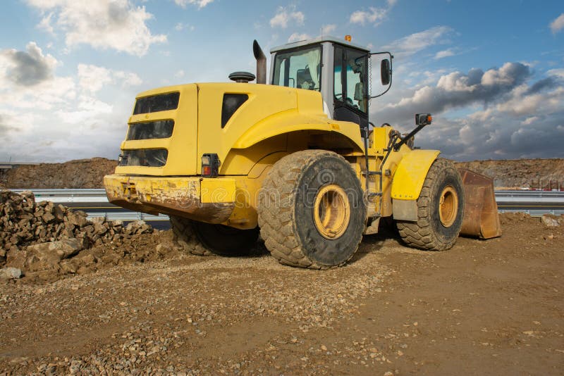 Excavator at a Construction Site, Performing Earth Moving Work Stock ...