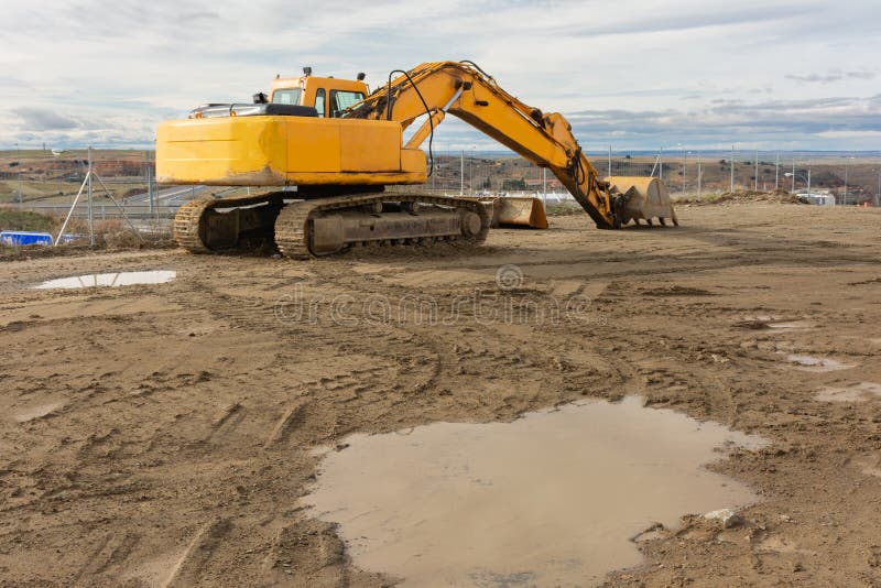 Excavator at a Construction Site, Performing Earth Moving Work Stock ...