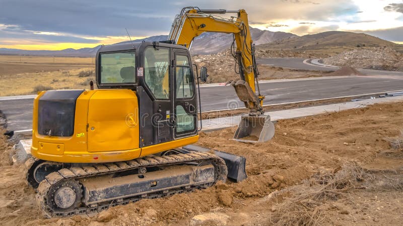 Excavator on a Construction Site beside a Road Stock Image - Image of ...