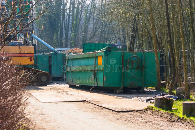 Excavator and Container on a Construction Site. Stock Photo - Image of ...
