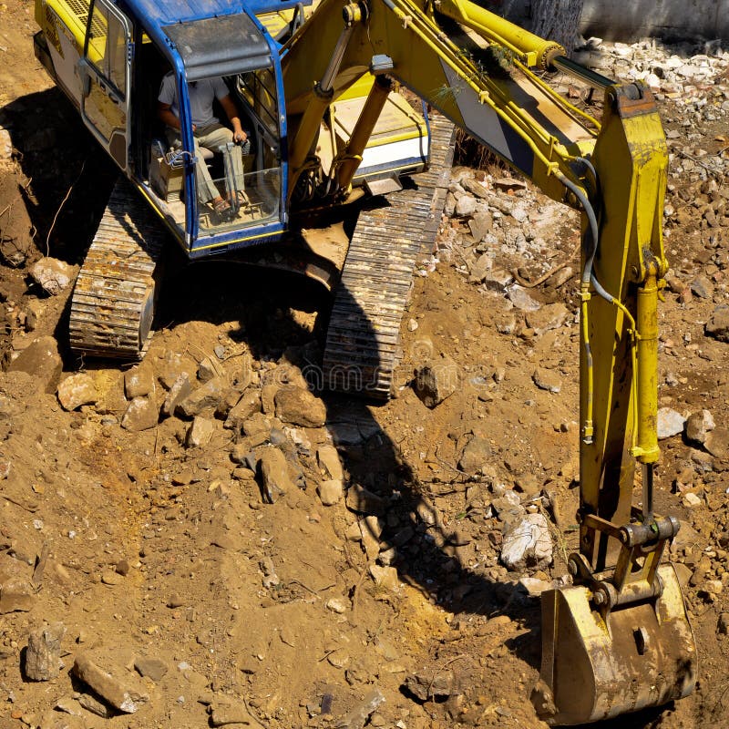 Excavator Continues To Work at the Construction Site Stock Photo ...
