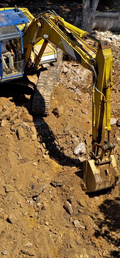 Excavator Continues To Work at the Construction Site Stock Photo ...