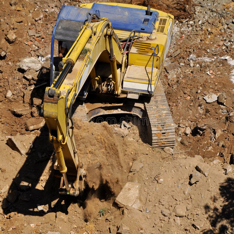 Excavator Continues To Work at the Construction Site Stock Photo ...