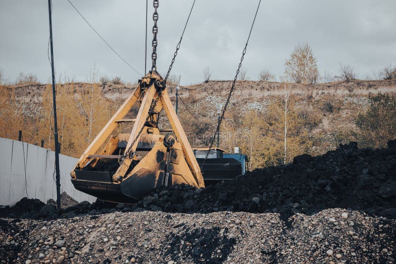 Excavator Crane is Engaged in Loading and Unloading Coal Busy Mining ...