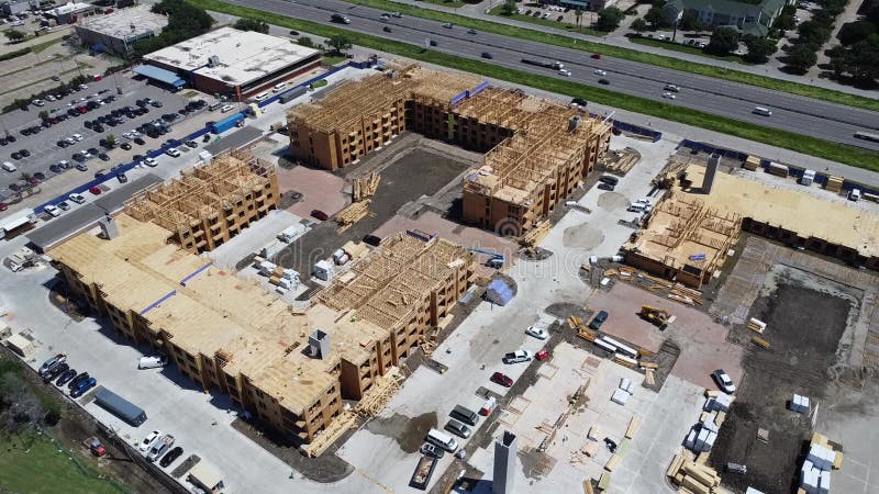 Excavator, Crane, Heavy Equipment and Workers at Apartment Complex ...
