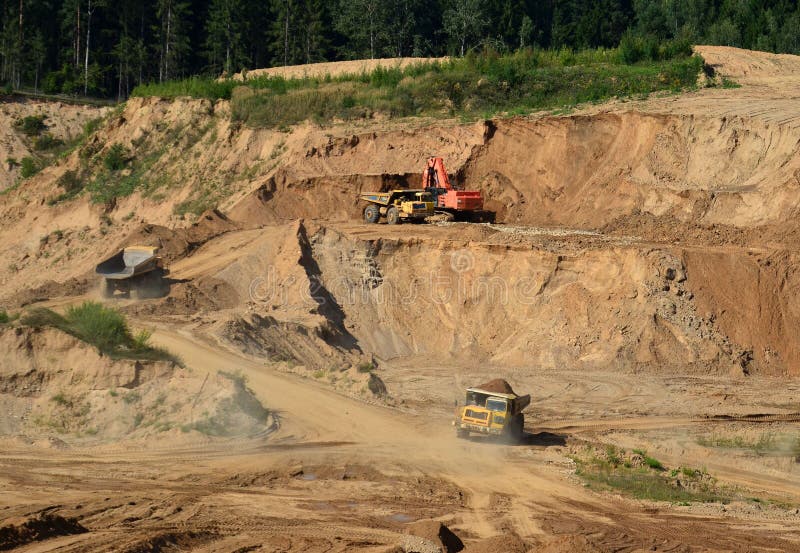 Mining, Loading Coal into a Dump Truck with an Excavator. Editorial ...