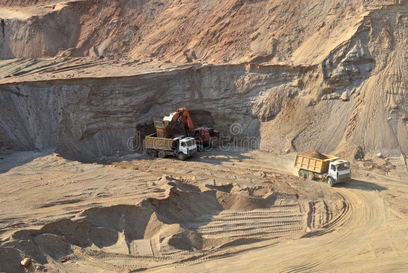Mining, Loading Coal Into A Dump Truck With An Excavator. Editorial ...
